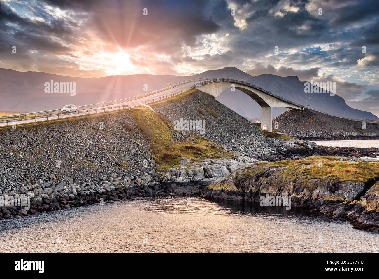 Atlantic Road Bridge with sunset and sun flare in norway Stock Photo ...