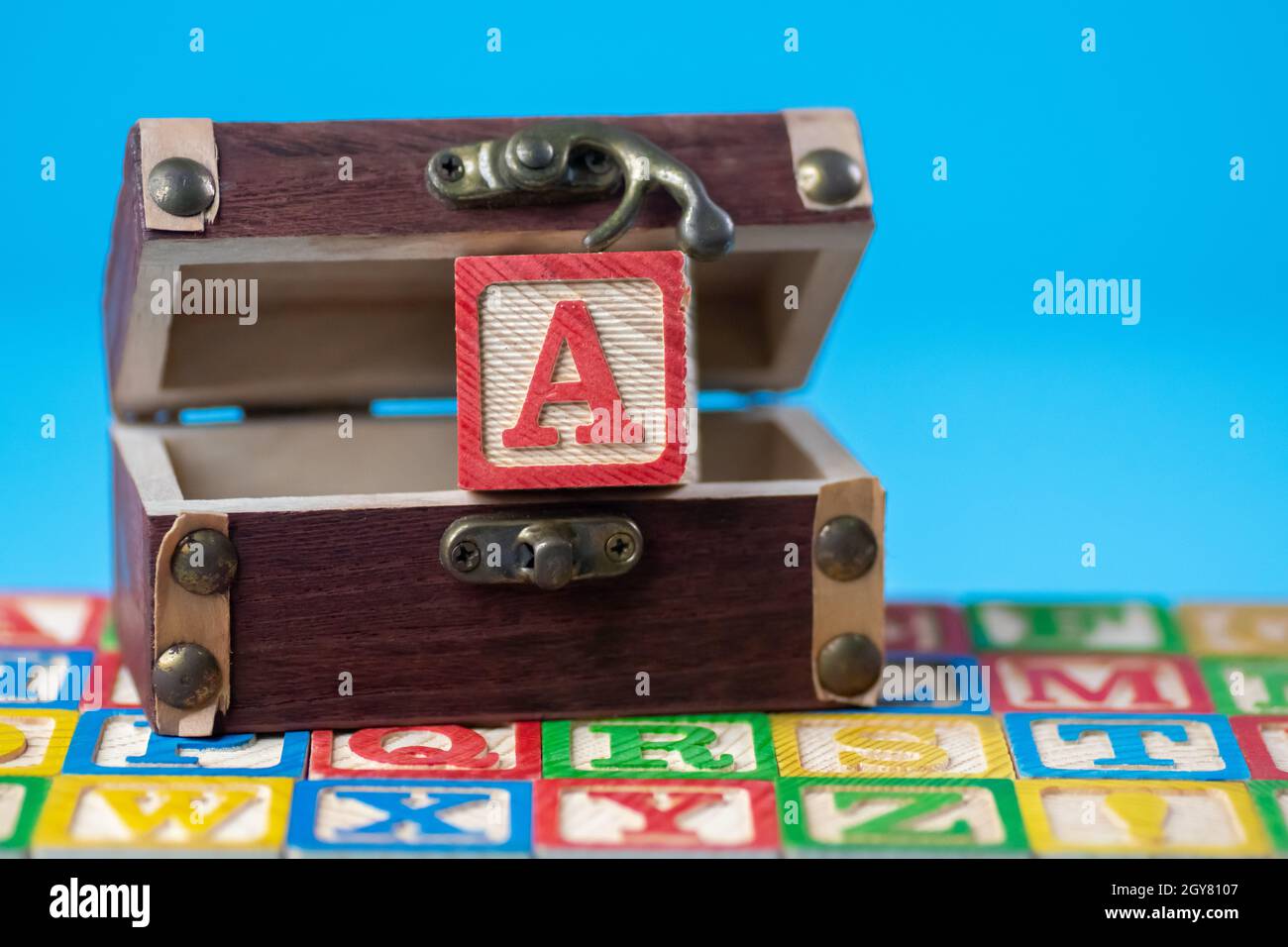 Capital letter A in treasure box in blue background Stock Photo - Alamy