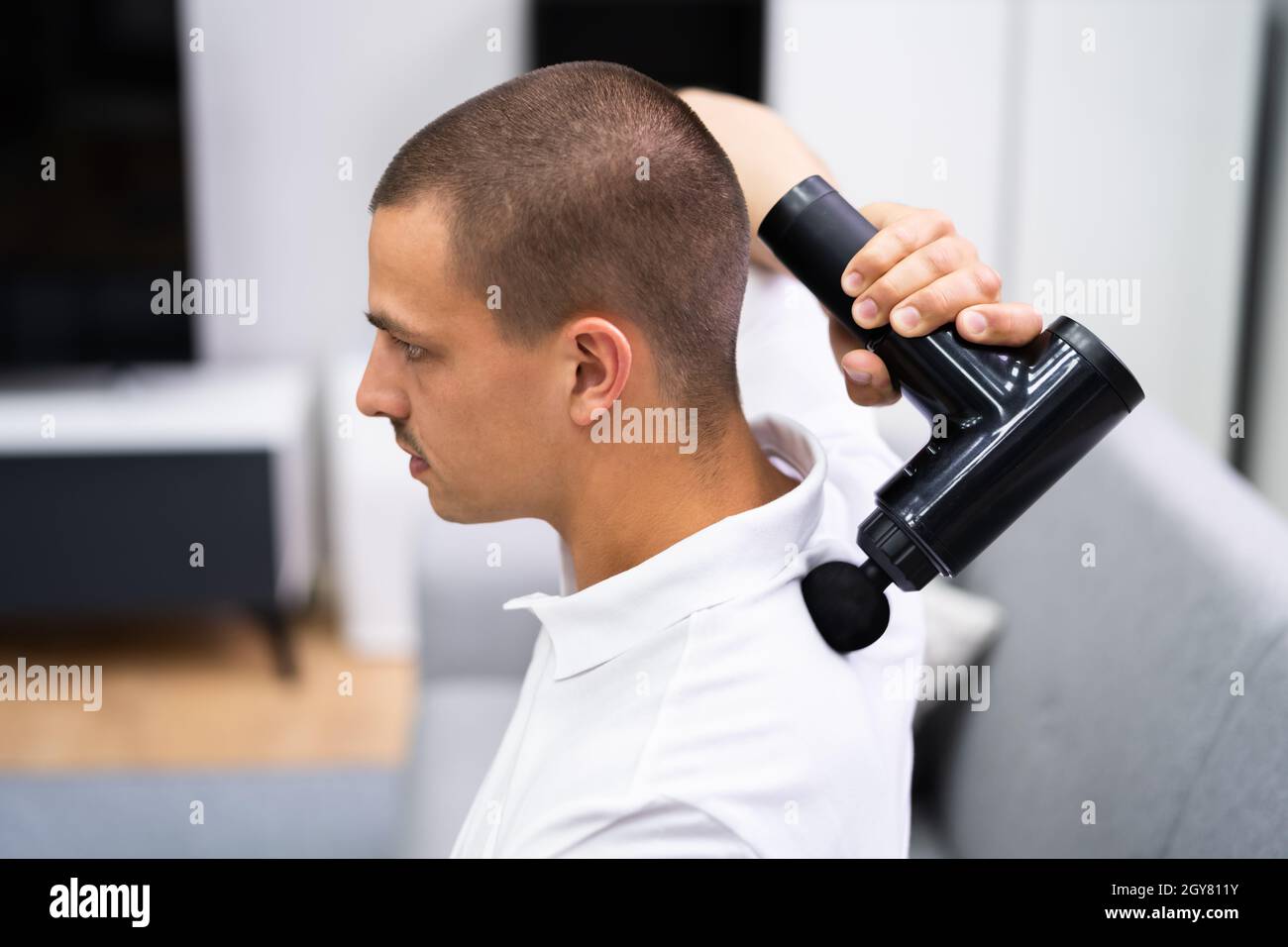 Electric Massage Gun Machine For Muscle Recovery Therapy Stock Photo - Alamy