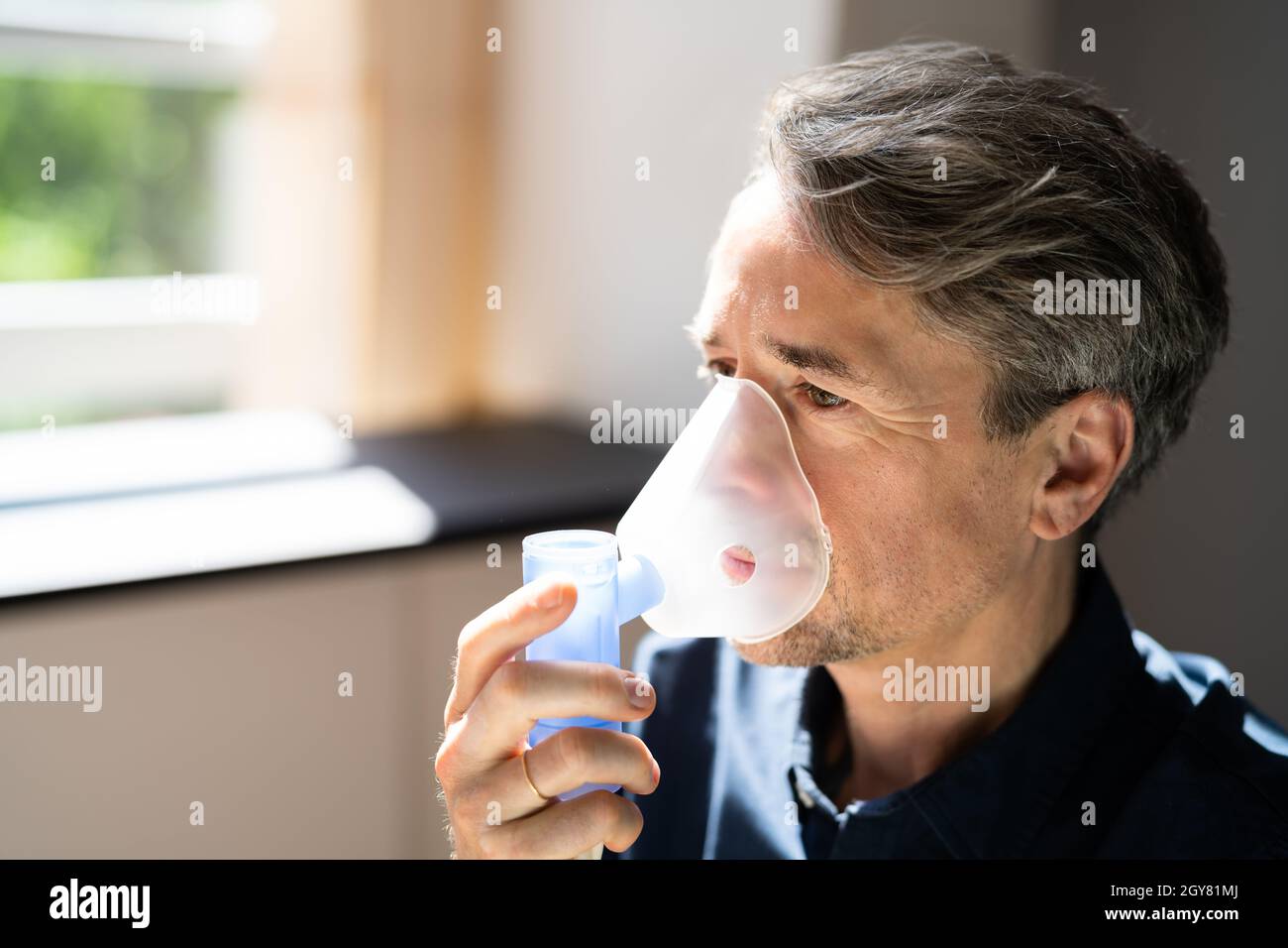 Oxygen Mask For Pulmonary Disease And Fibrosis. Man Inhaling Stock ...