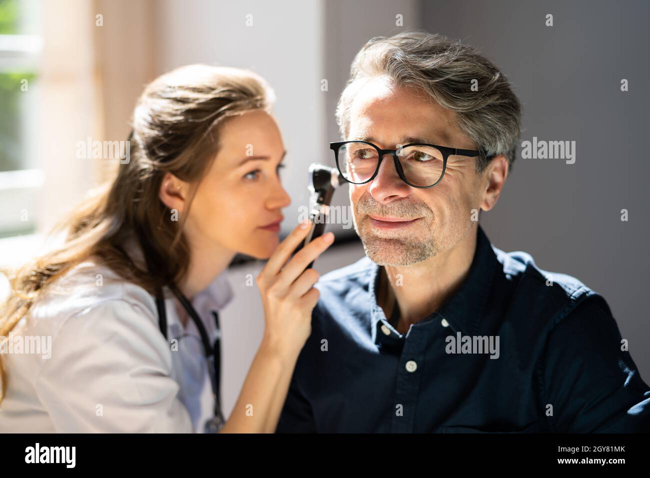 Otolaryngology Ear Check Using Otoscope. Doctor Examining Patient Stock ...