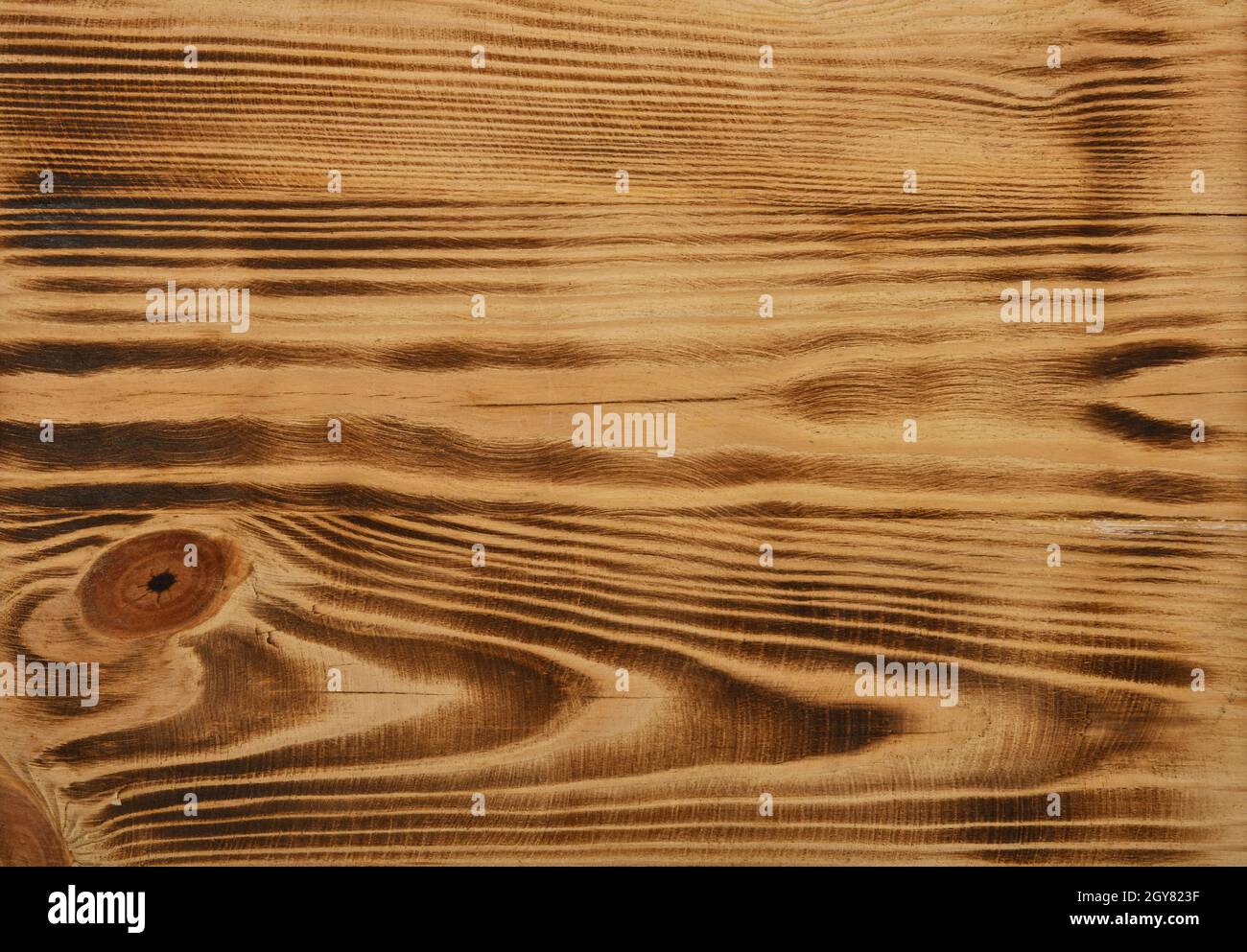 Close up background texture of vintage weathered burnt and brushed pine ...