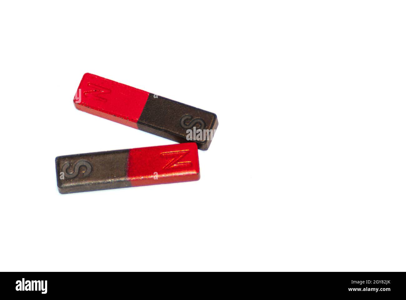 two magnets isolated on white Stock Photo - Alamy