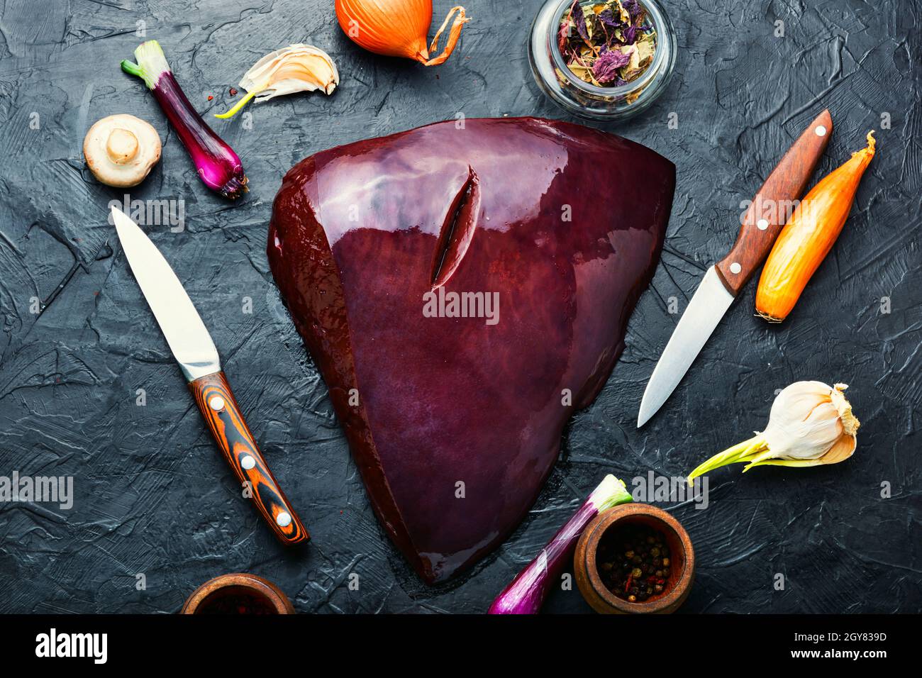 Piece of raw beef liver on the kitchen table.Fresh liver for cooking ...