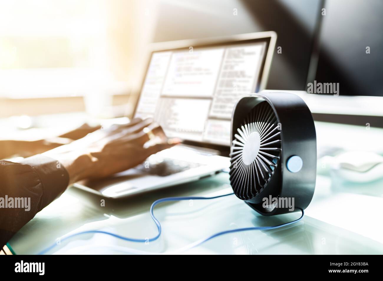 Electric Fan In Office During Hot Weather Stock Photo - Alamy