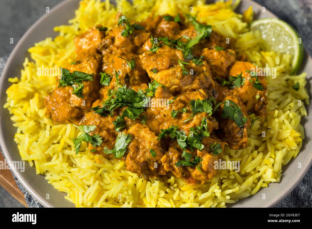 Homemade Indian Chicken Biryani with Yellow Rice Stock Photo - Alamy