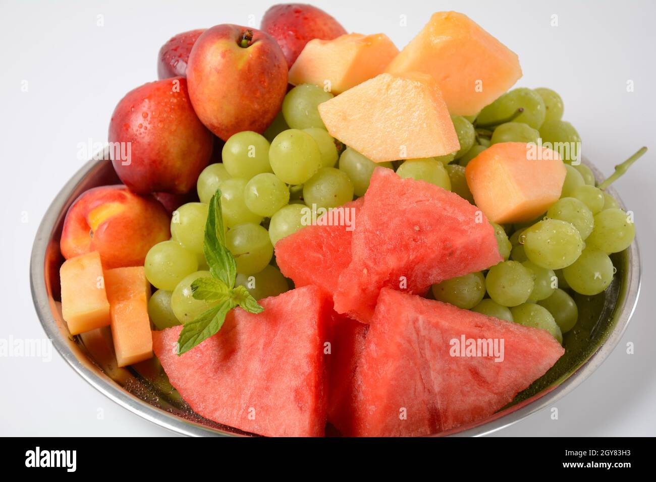 Fruit mix. Nectarine, grapes, watermelon, melon. Pieces of fruit on a ...