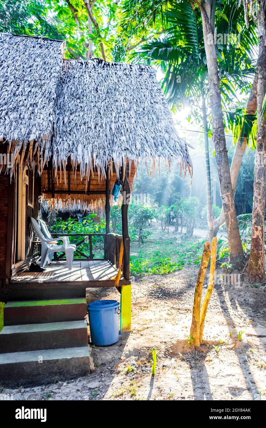 Sunrise in Thai beach resort with wooden cottages huts cabins in the ...