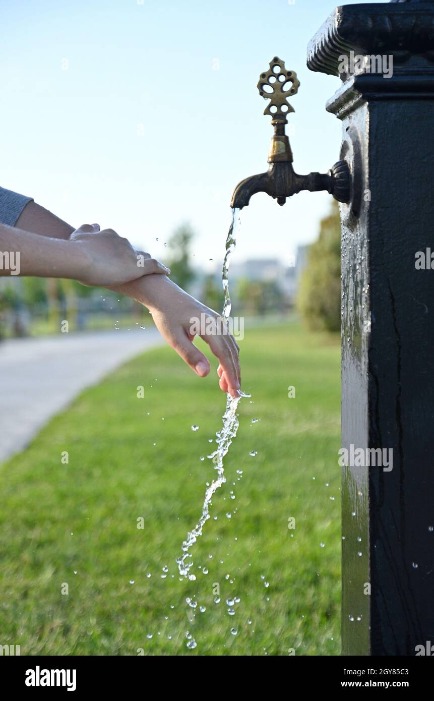 Tap water drop hands hi-res stock photography and images - Alamy