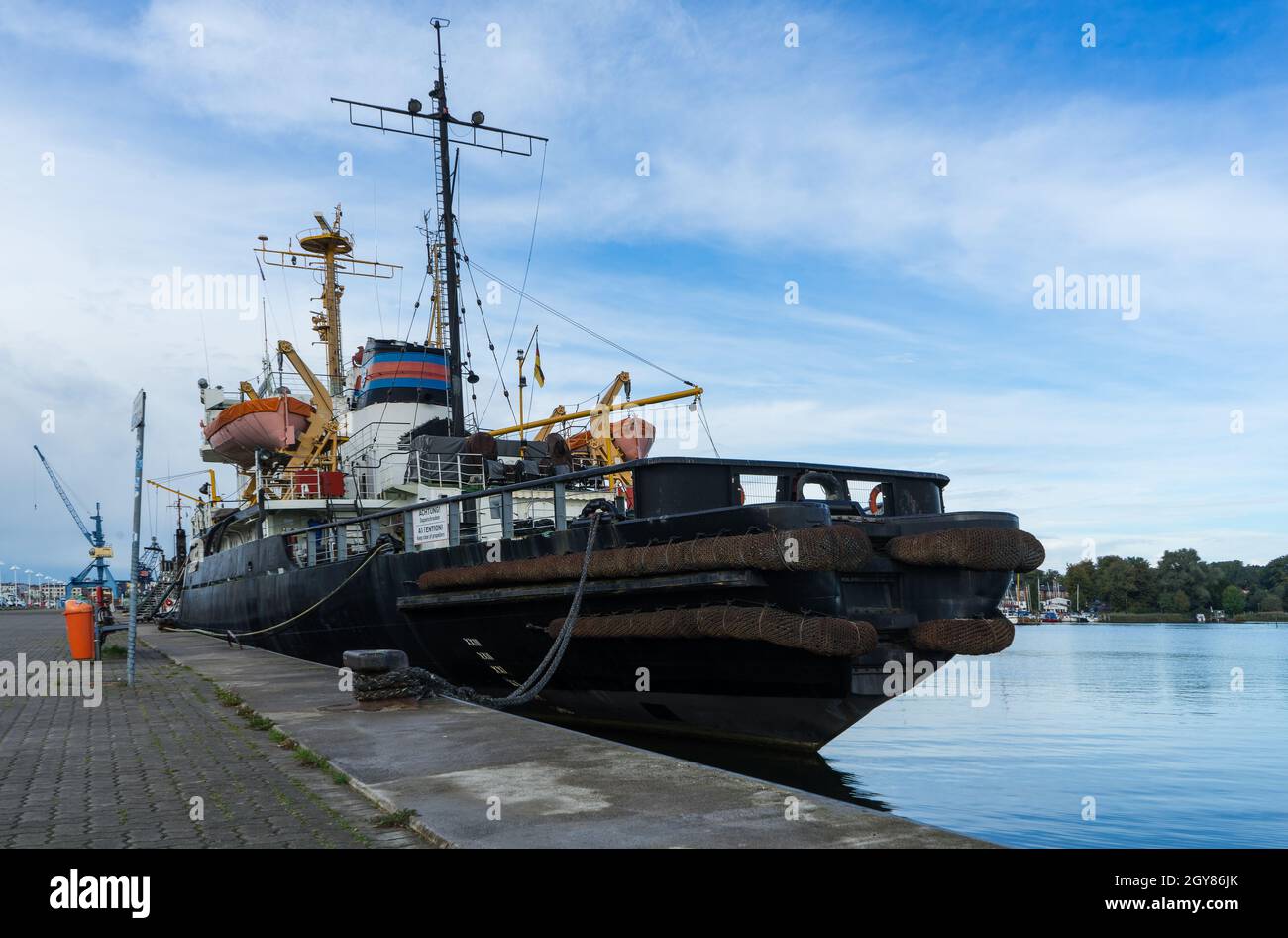 Ship in the harbor of the german city called Rostock at autumn Stock ...