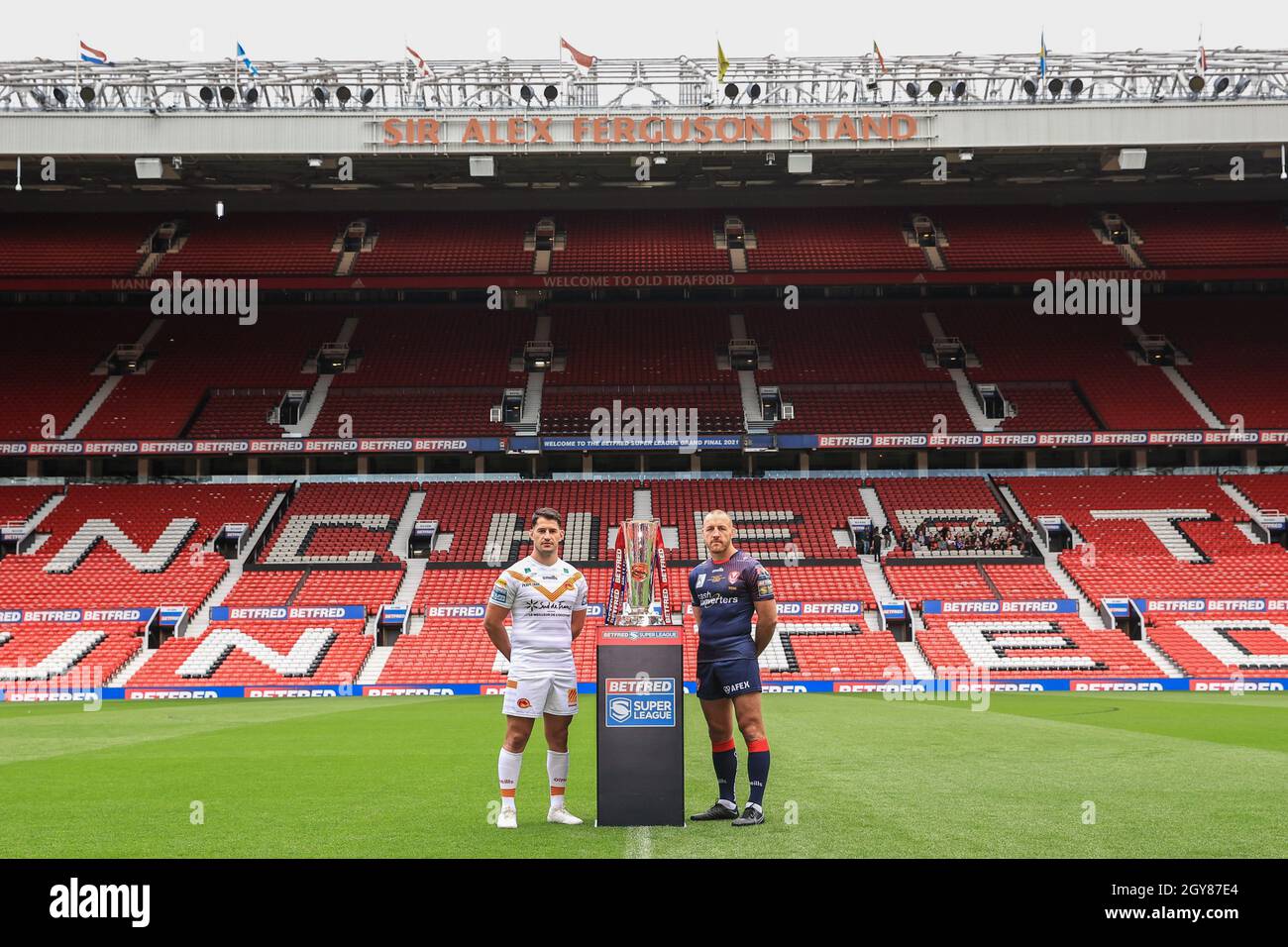 Benjamin Garcia of Catalans Dragons and James Roby of St Helens stand ...