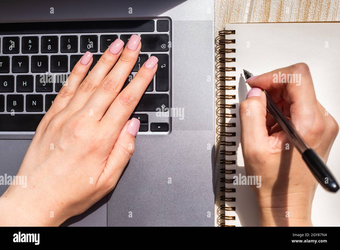Hands Pressing Computer Keyboard Keys While Writing With Pencil In ...