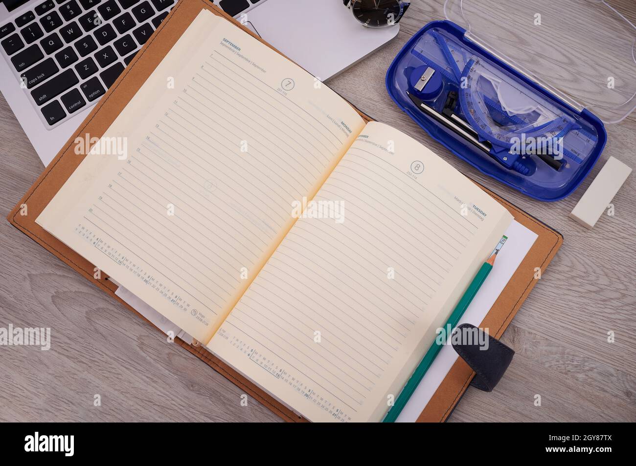 Opened Empty Notepad Over A Laptop With Compass Pen Wristwatch Stock ...