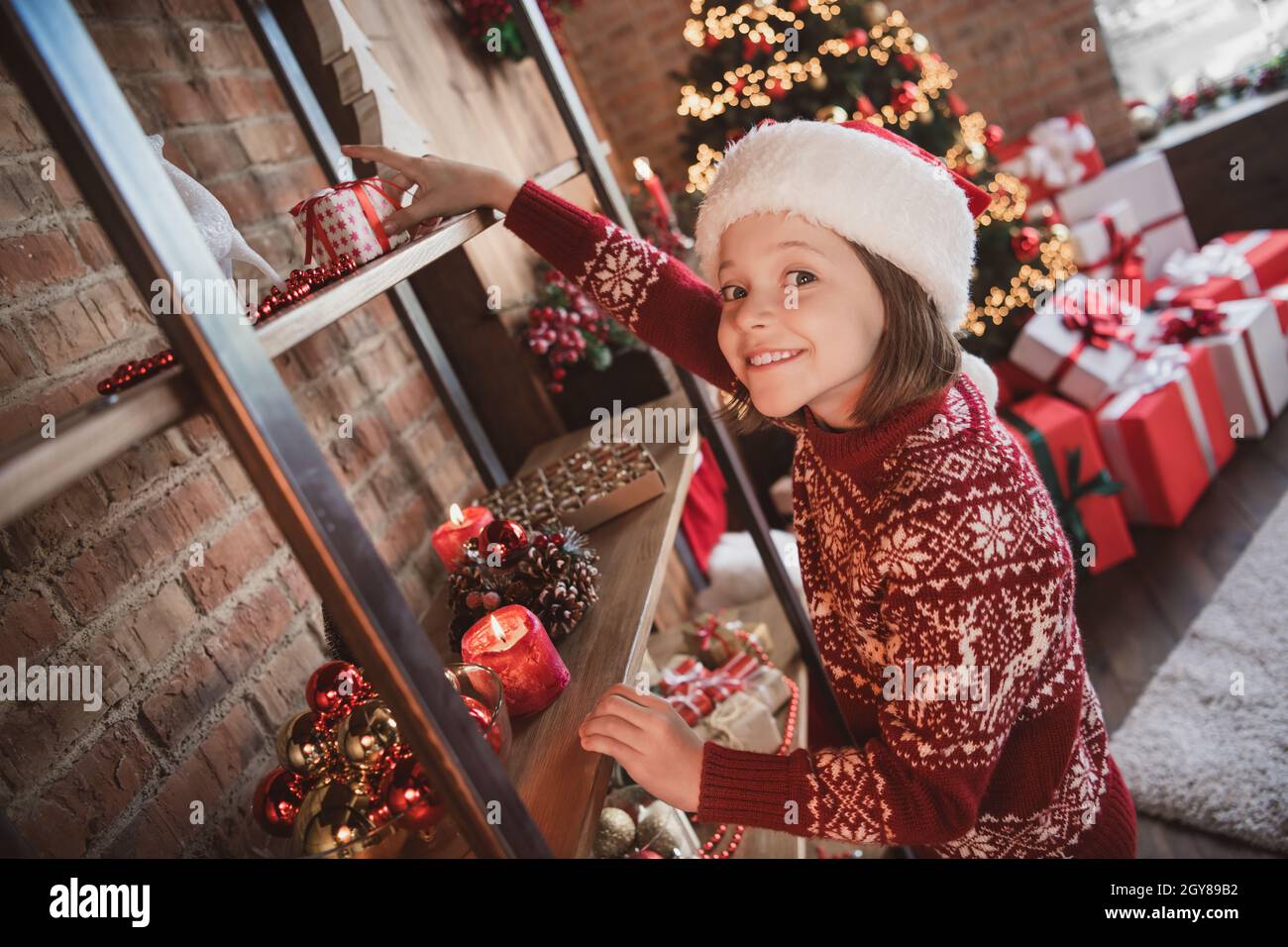 Photo of sweet pretty school girl wear print pullover headwear smiling ...
