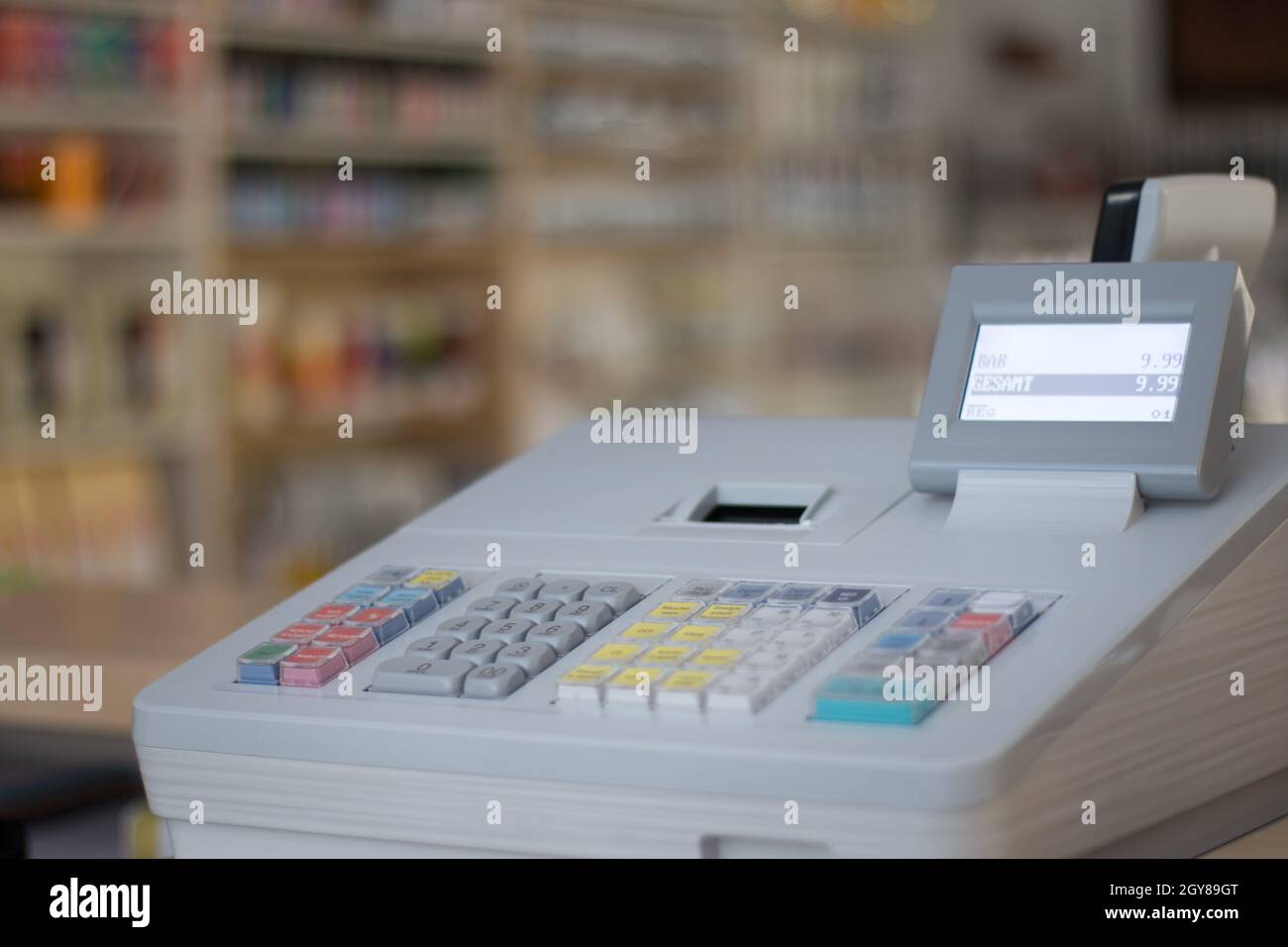 Cash register in a shop: Customer is paying purchase Stock Photo - Alamy