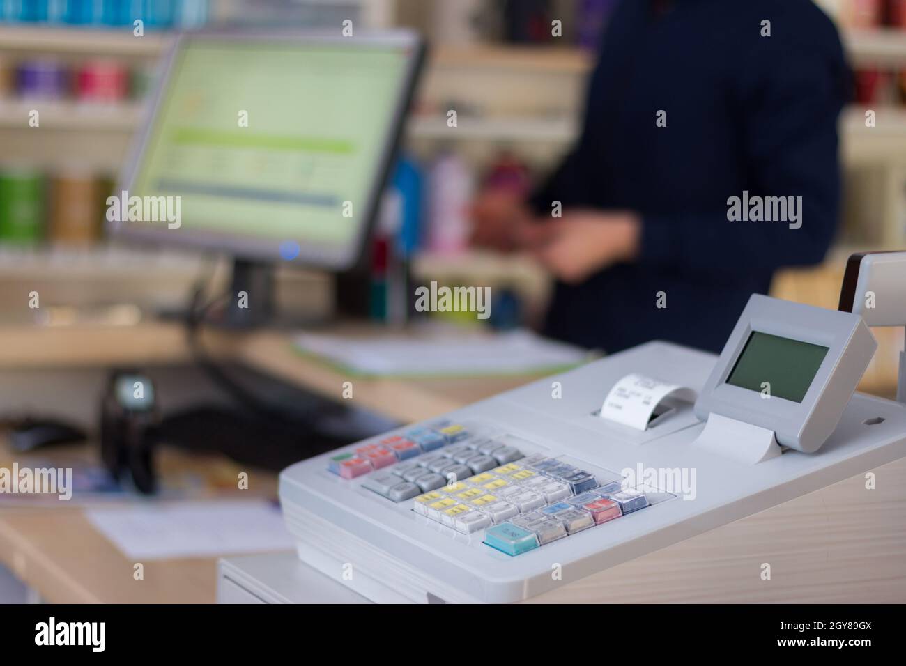 Cash register in a shop: Customer is paying purchase Stock Photo - Alamy