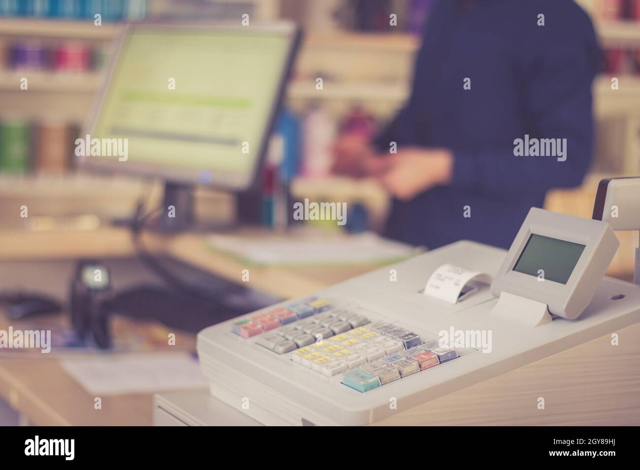 Cash register in a shop: Customer is paying purchase Stock Photo - Alamy