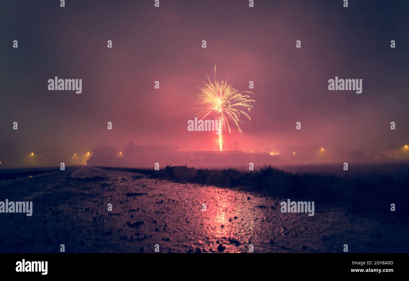 Firework at new year on a dusty wet landscape, Austria Stock Photo - Alamy