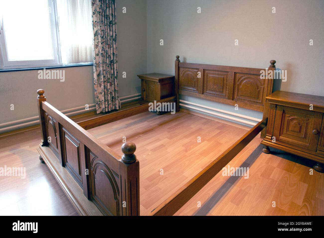Antique wooden bed frame, old and vintage design. Wooden bed in bedroom ...