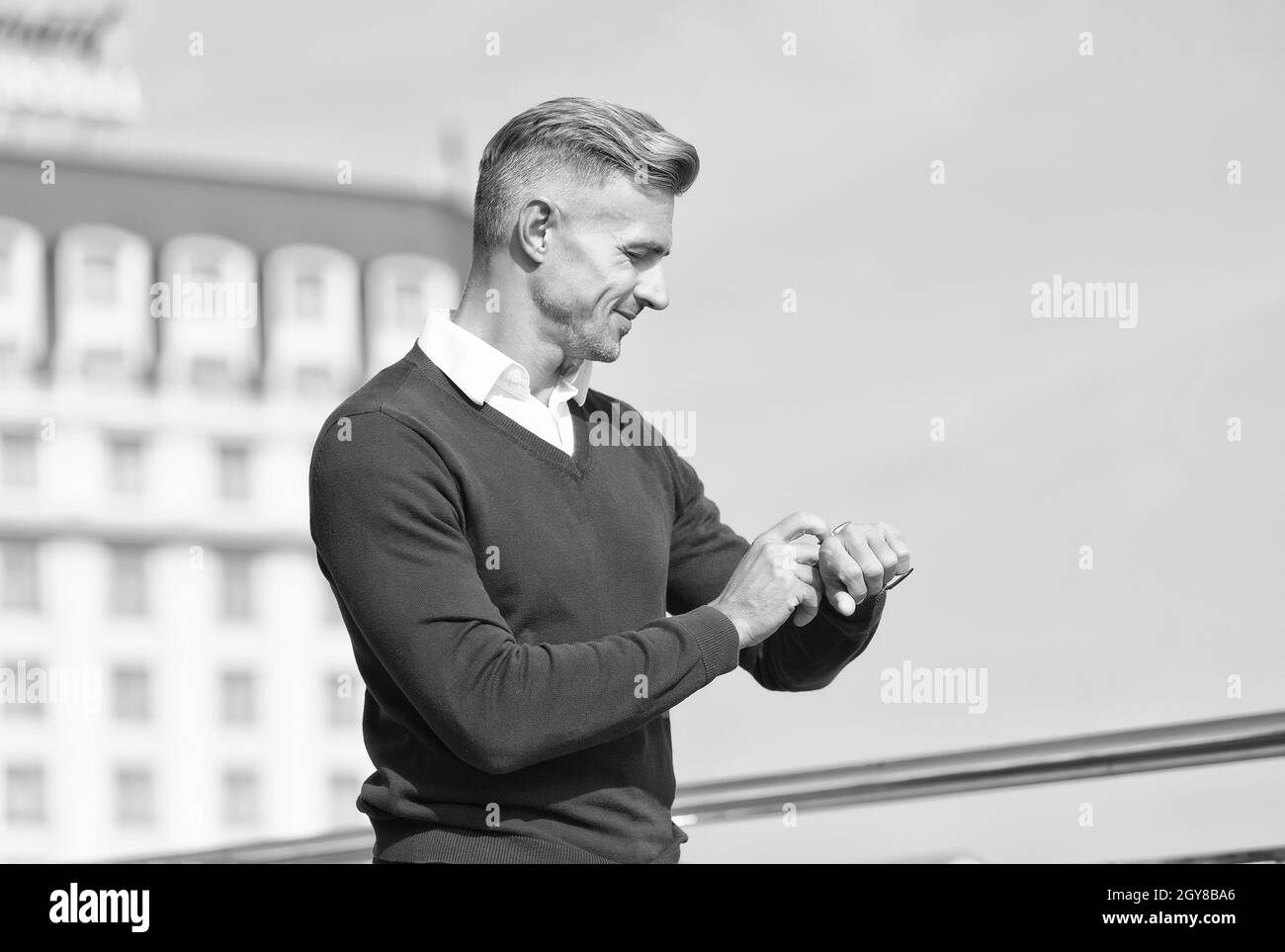 Man check watch urban background. Handsome man wear wrist watch. Using ...