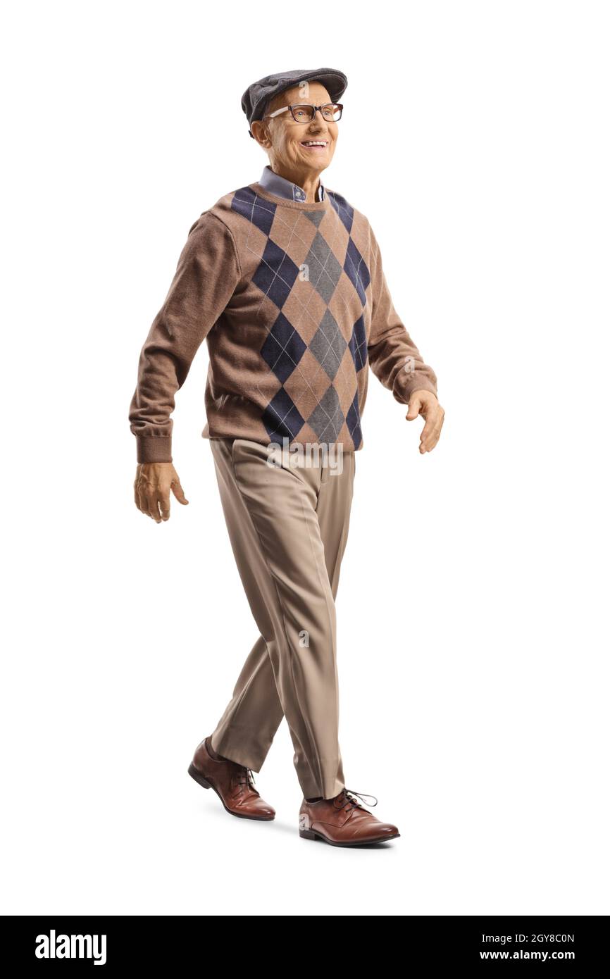 Full length shot of an elderly gentleman walking and smiling isolated ...