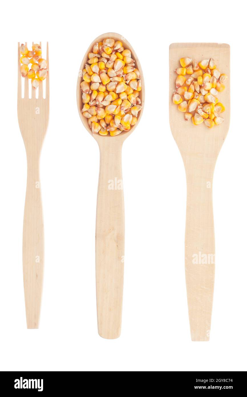 Wooden spoon, fork, paddle with corn, isolated on white background ...