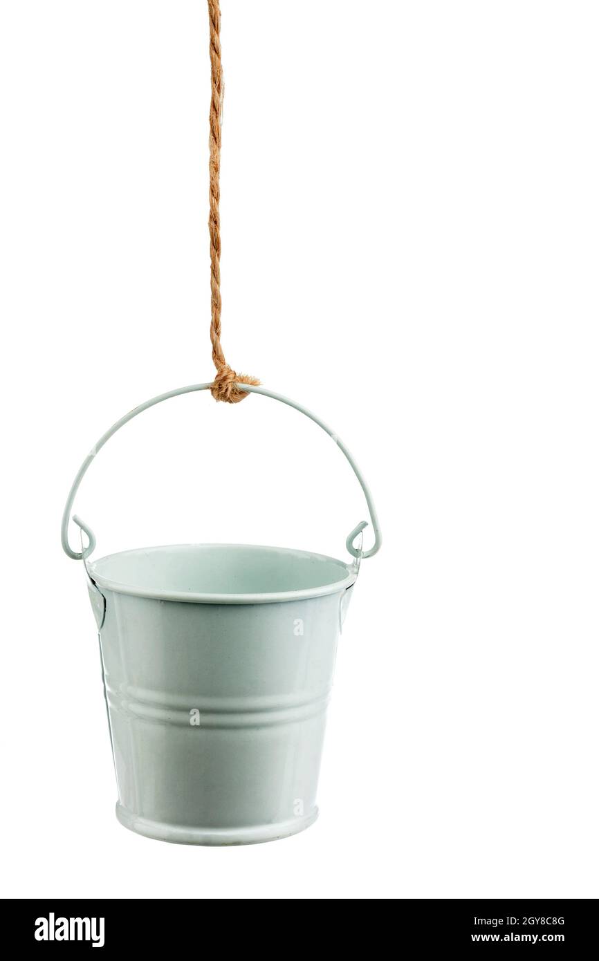 Iron bucket on a rope, isolated on white background Stock Photo - Alamy