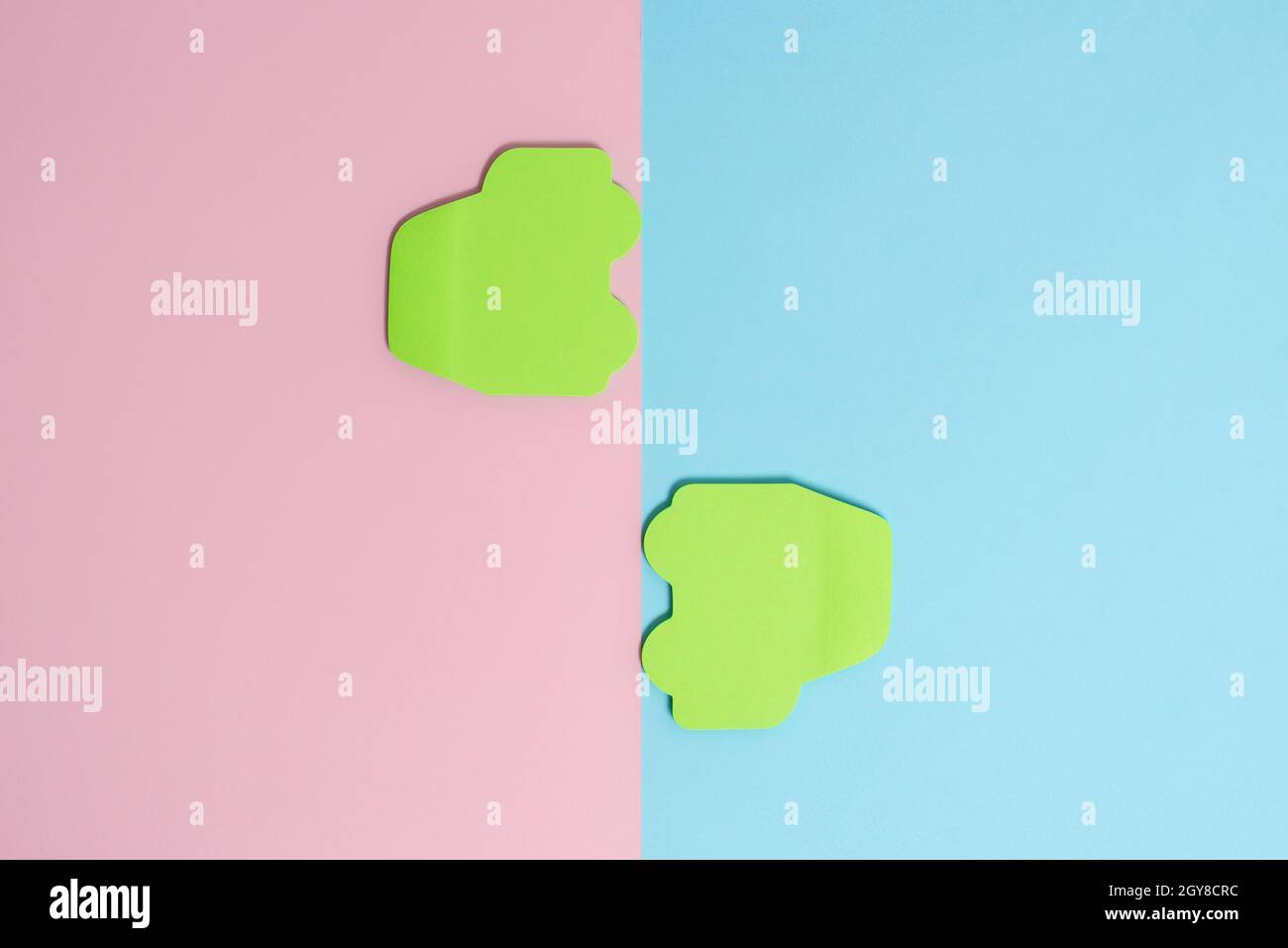 Two Objects Arranged Facing Inward Outward On a Separated Coloured ...