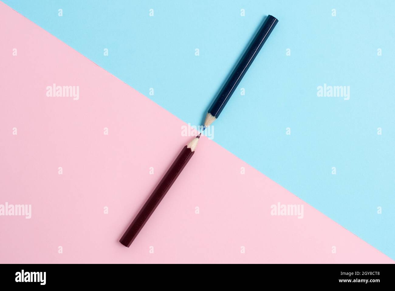 Two Objects Arranged Facing Inward Outward On a Separated Coloured ...