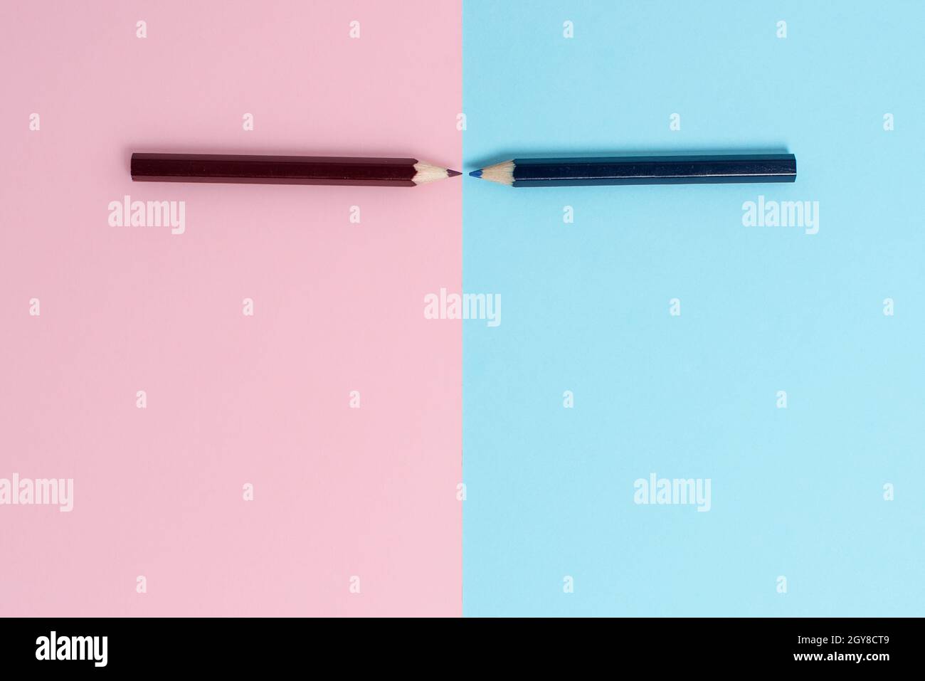 Two Objects Arranged Facing Inward Outward On a Separated Coloured ...