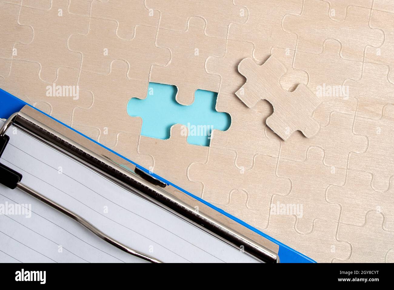 Building An Unfinished White Jigsaw Pattern Puzzle With Missing Last ...