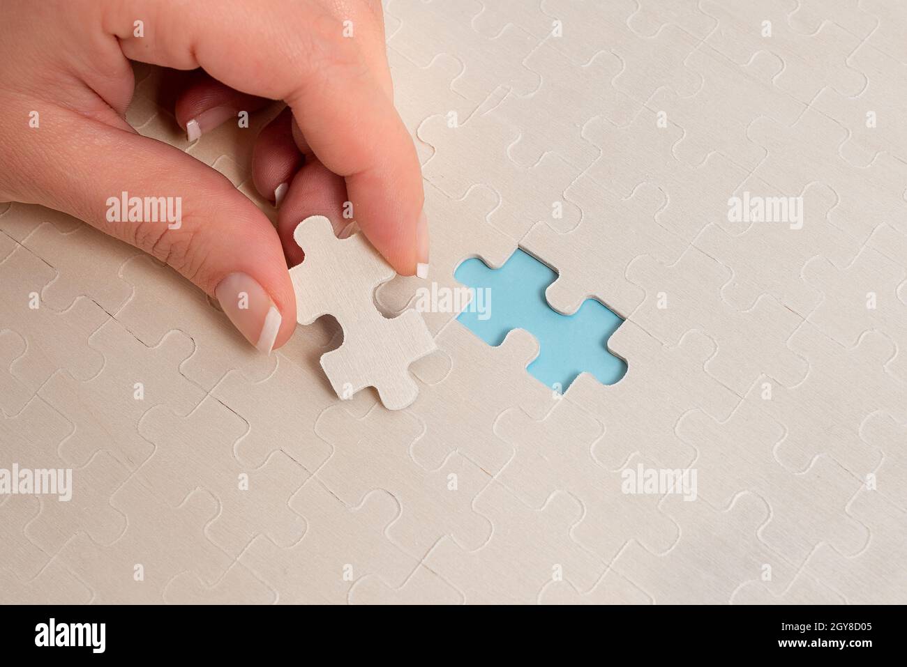 Building An Unfinished White Jigsaw Pattern Puzzle With Missing Last ...
