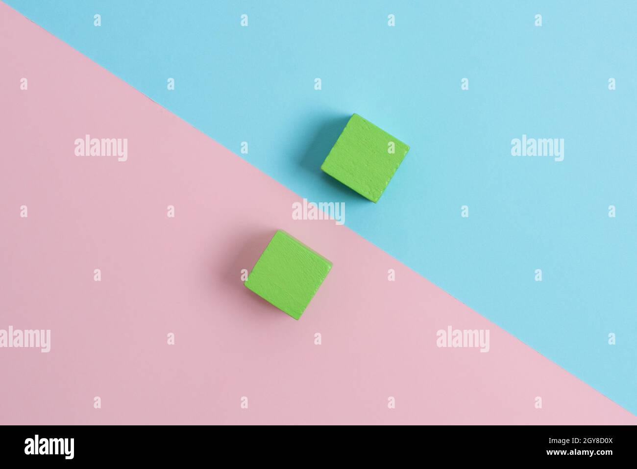 Two Objects Arranged Facing Inward Outward On a Separated Coloured ...