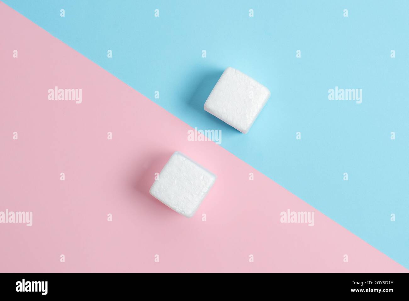 Two Objects Arranged Facing Inward Outward On a Separated Coloured ...