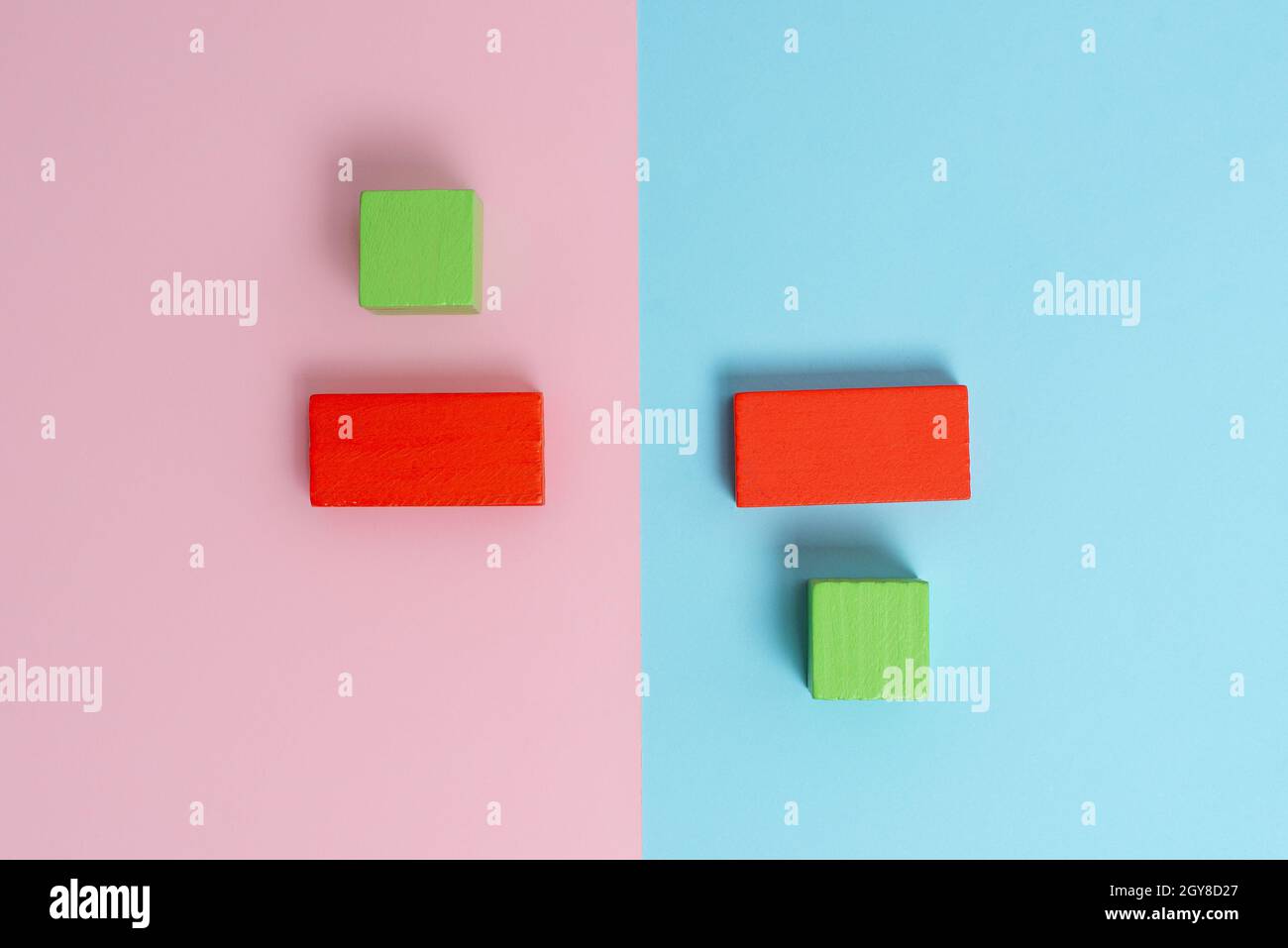 Two Objects Arranged Facing Inward Outward On a Separated Coloured ...