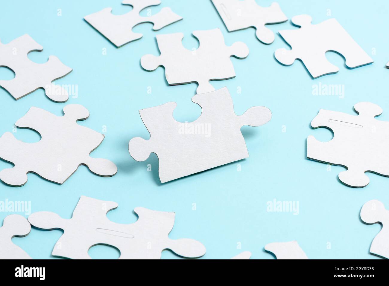 Building An Unfinished White Jigsaw Pattern Puzzle With Missing Last ...