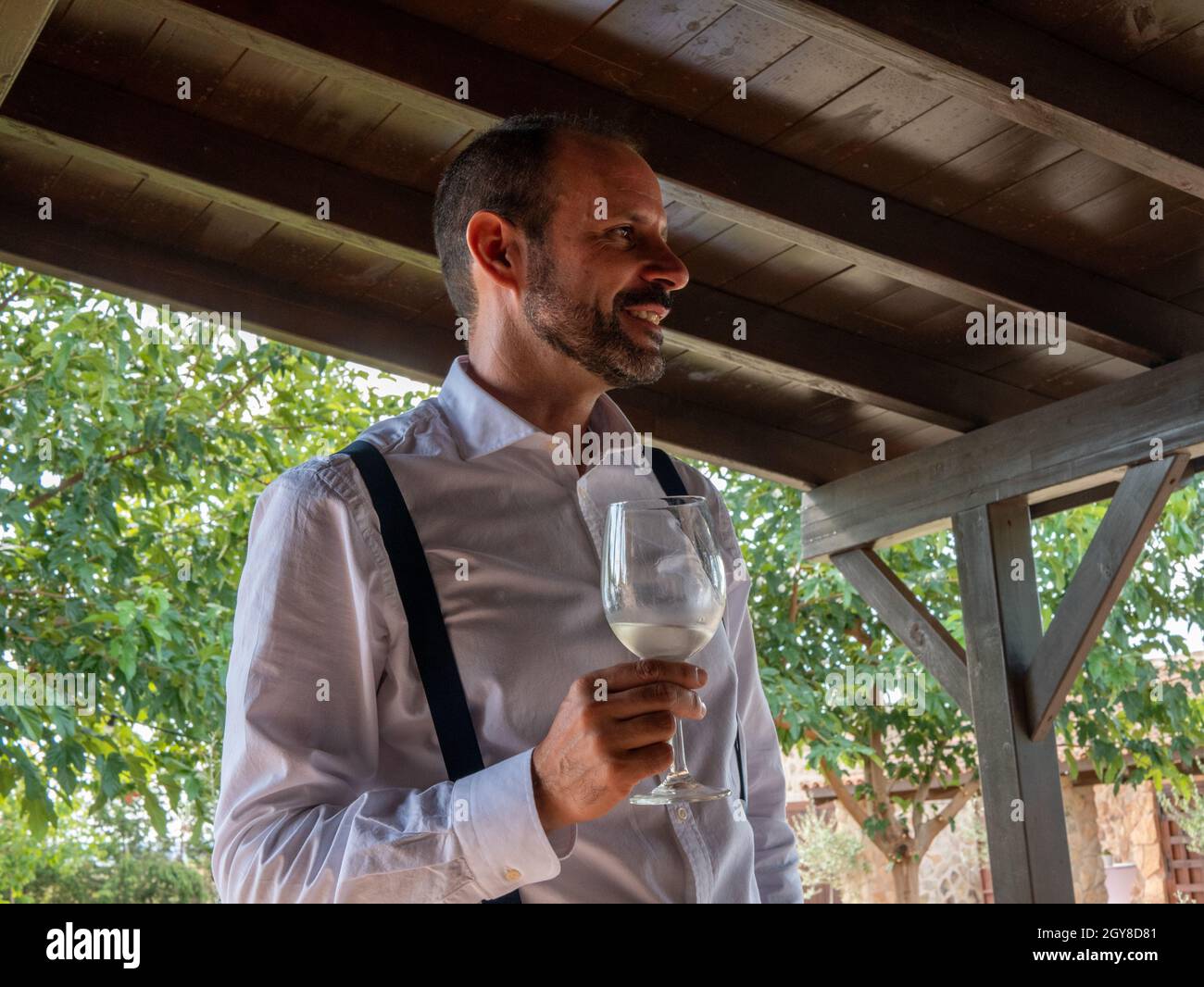 Spanish man drinking white wine Stock Photo - Alamy