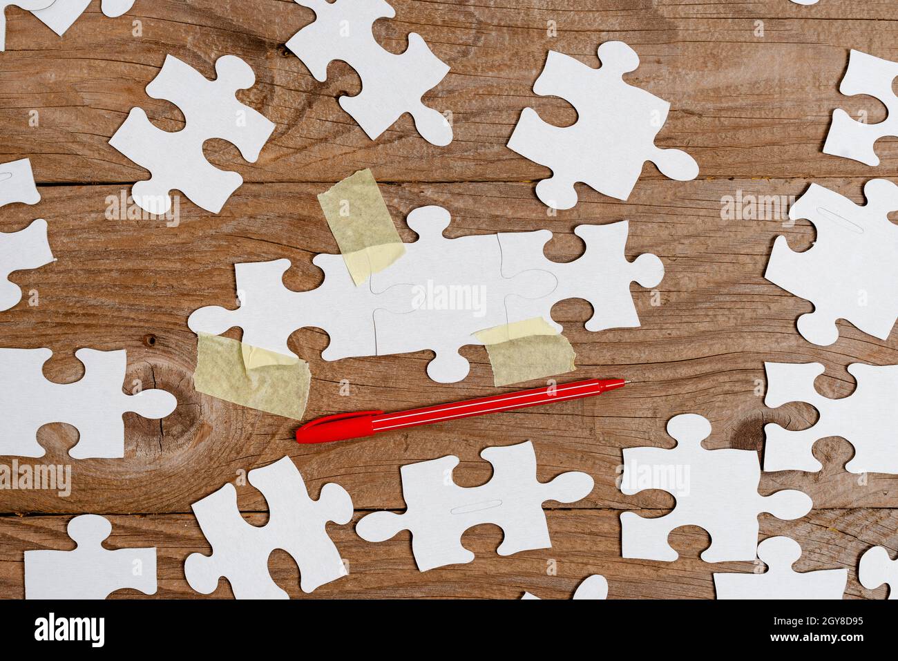 Building An Unfinished White Jigsaw Pattern Puzzle With Missing Last ...