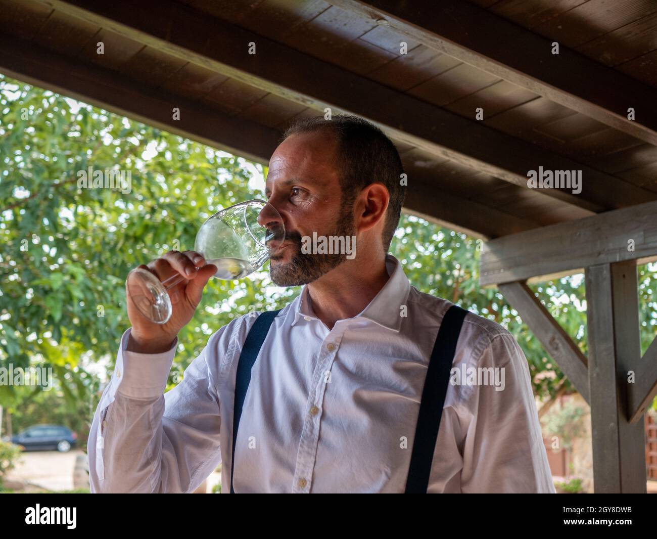 Spanish man drinking white wine Stock Photo - Alamy