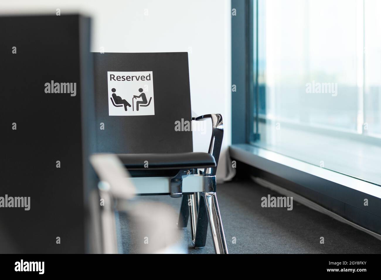Empty seats in airport reserved for seniors and pregnant. Chairs in big ...