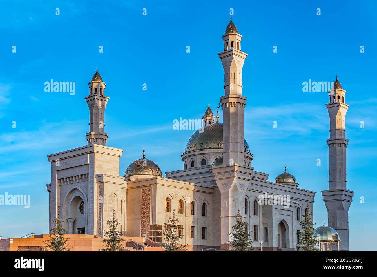 A Muslim Islamic mosque with golden minarets and a crescent moon ...