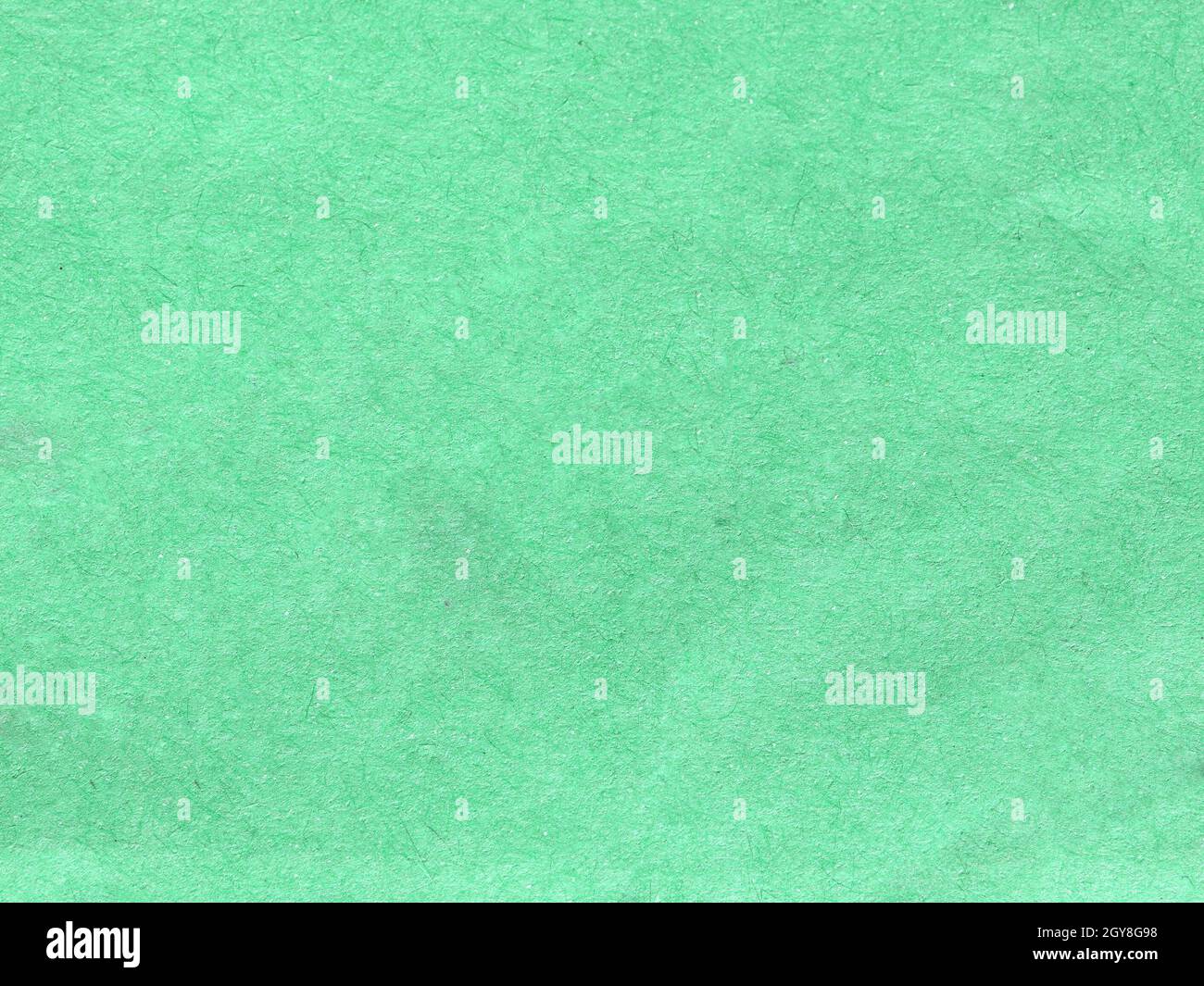 green cardboard texture useful as a background Stock Photo - Alamy