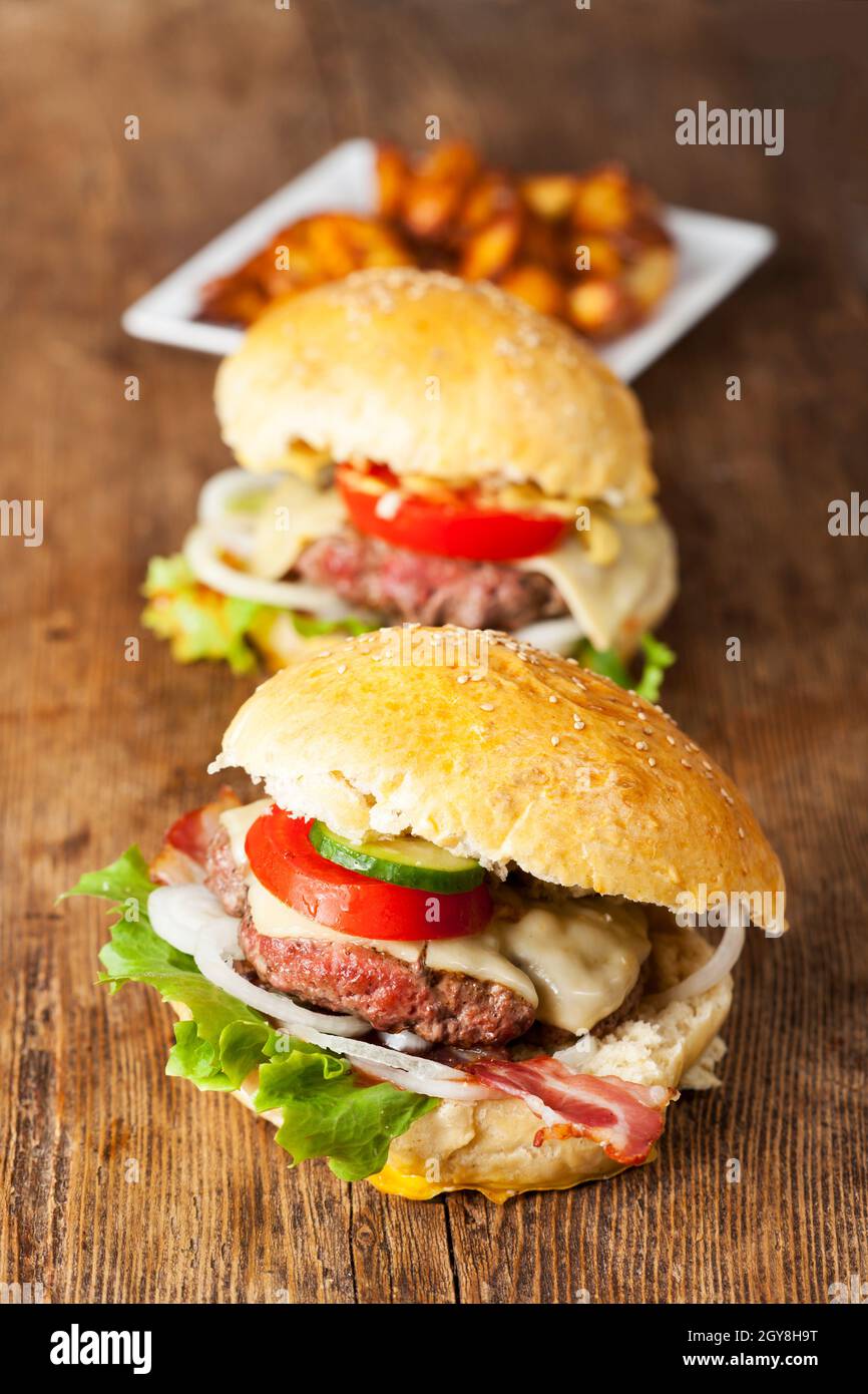 home made hamburger on rustic wood Stock Photo - Alamy