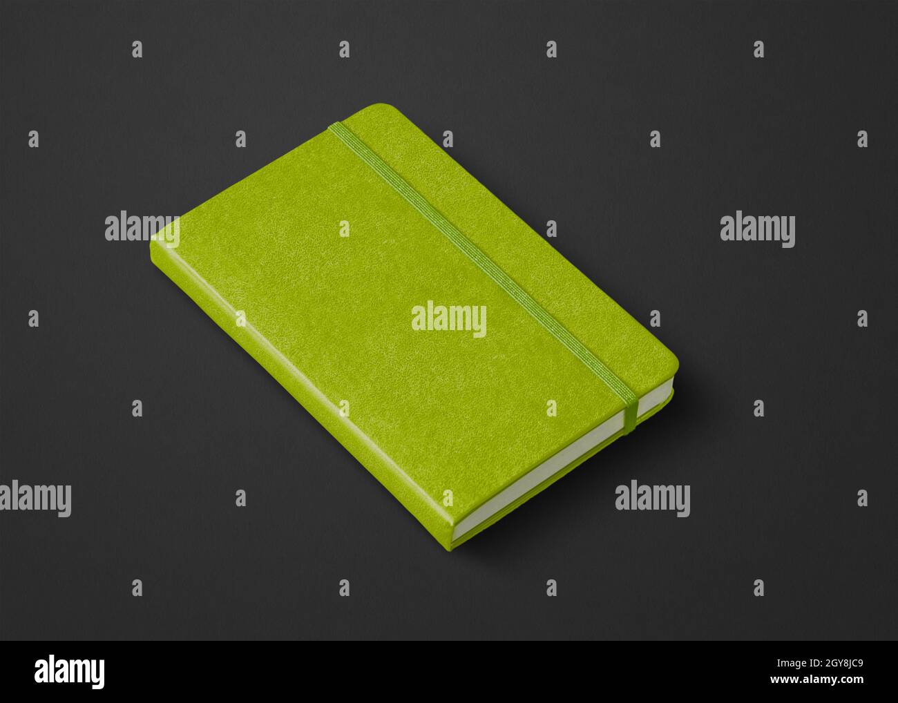 Lime green closed notebook mockup isolated on black Stock Photo - Alamy