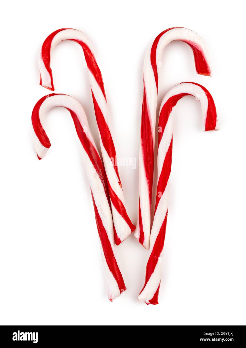 Stack of candy canes isolated on white background Stock Photo - Alamy