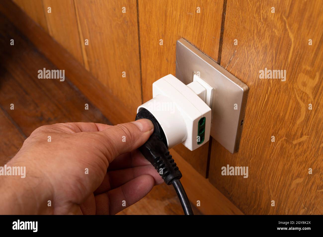 remove the plug from the socket to save energy Stock Photo - Alamy