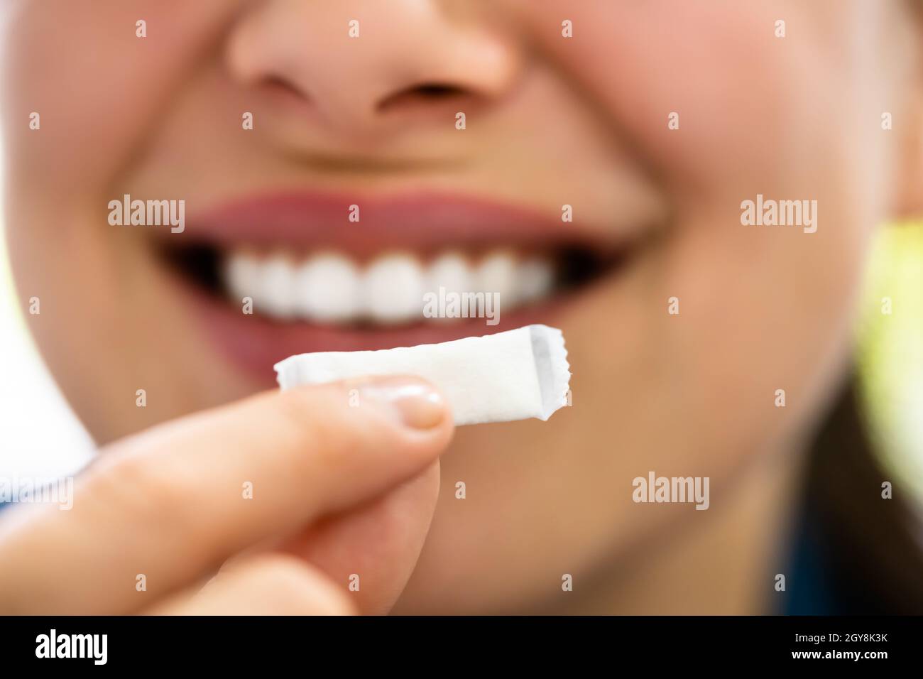 Woman Chewing Wet Moist Nicotine Tobacco Snus Product Stock Photo - Alamy