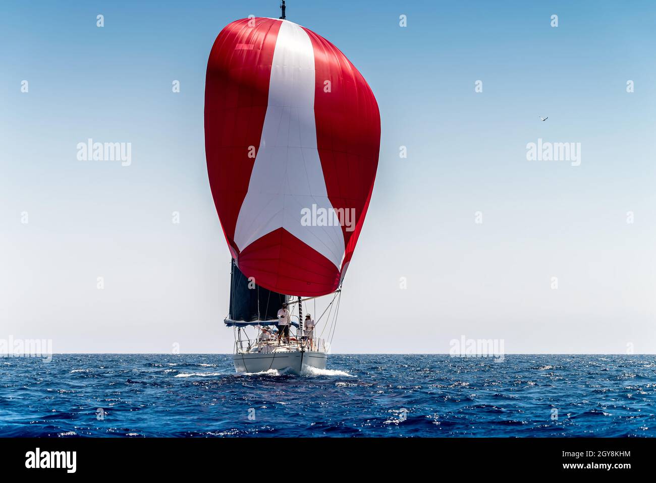 Sailing boat with red sail during the regatta Stock Photo - Alamy