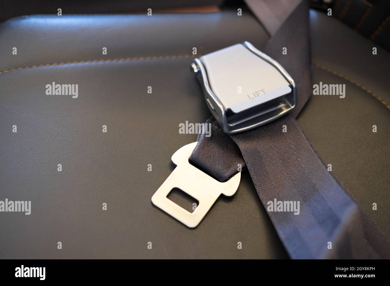Safety belt on seat in airplane Flight safety concept Closeup Stock ...