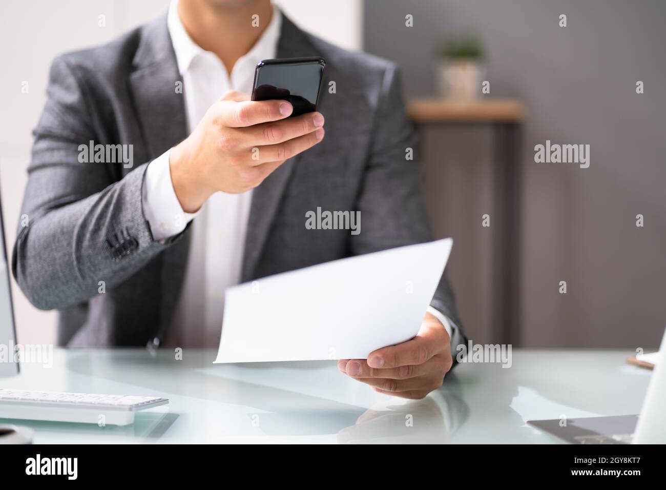 Remote Check Deposit Taking Photo With Mobile Phone Stock Photo - Alamy